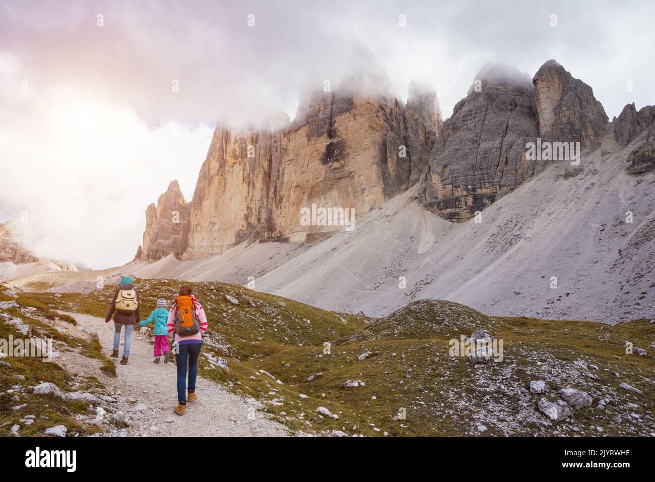happy family - smiling mother and two sisters girls hikers at the ...
