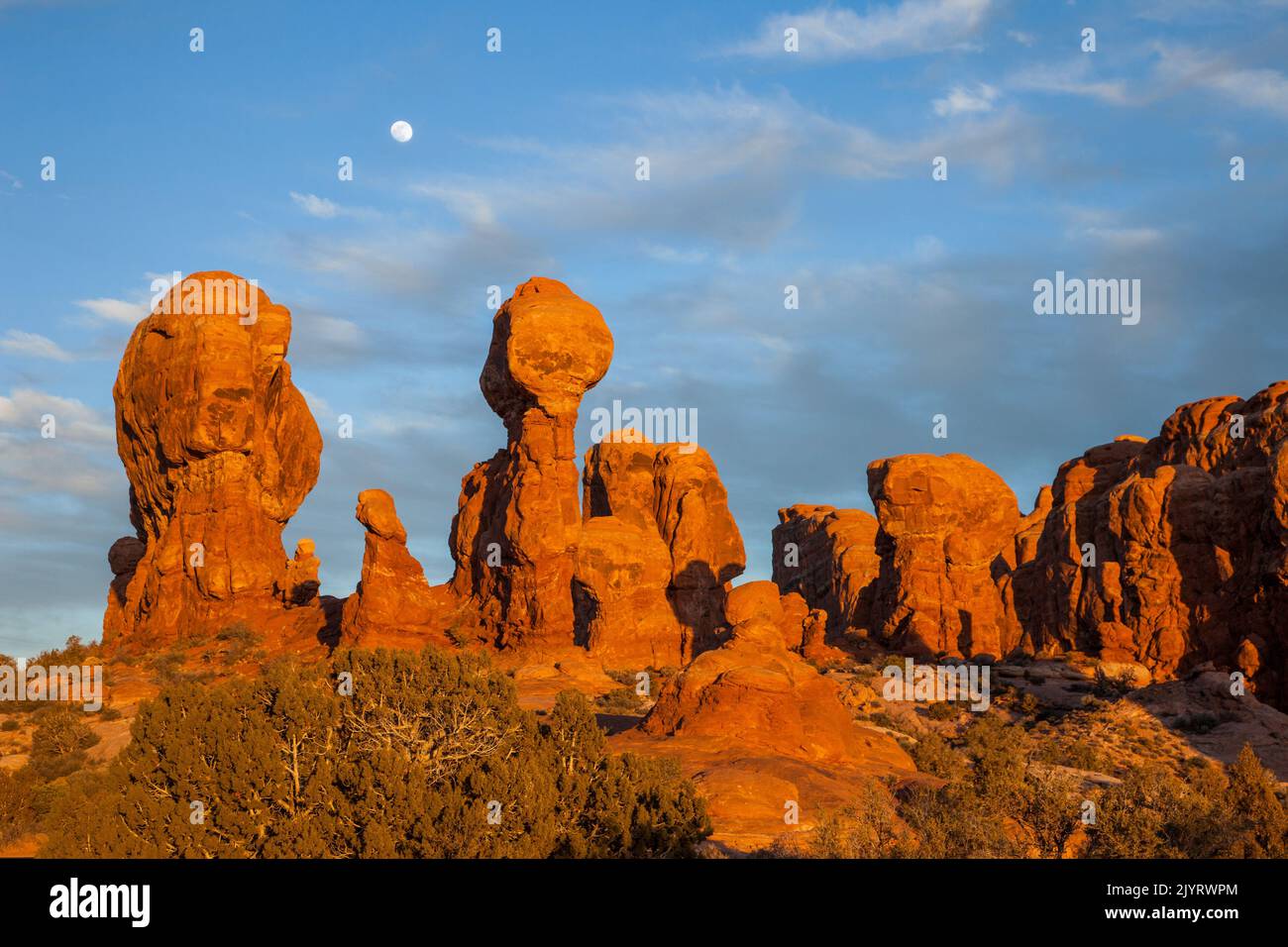Moon rising over Adam and Eve, sandstone pinnacles of the Garden of ...