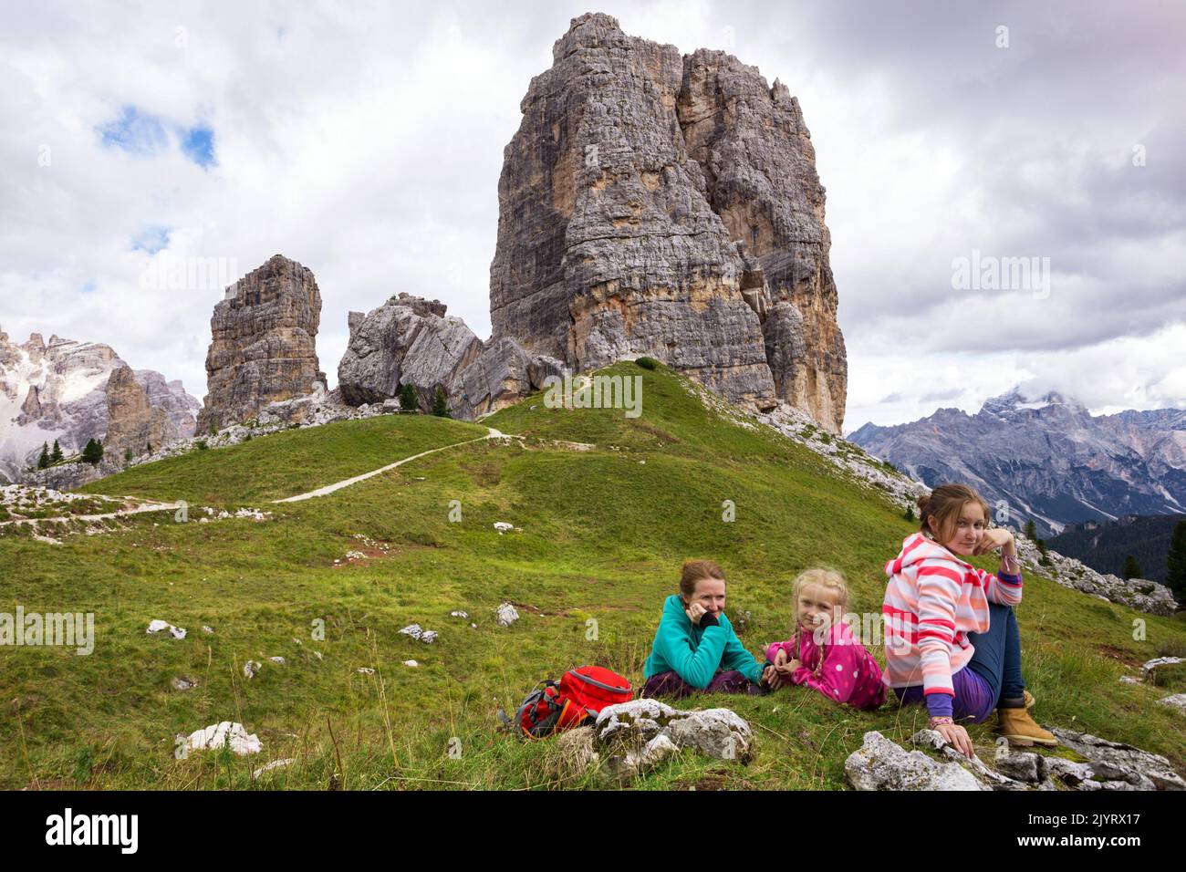 happy family - smiling mother and two sisters girls hikers at the ...