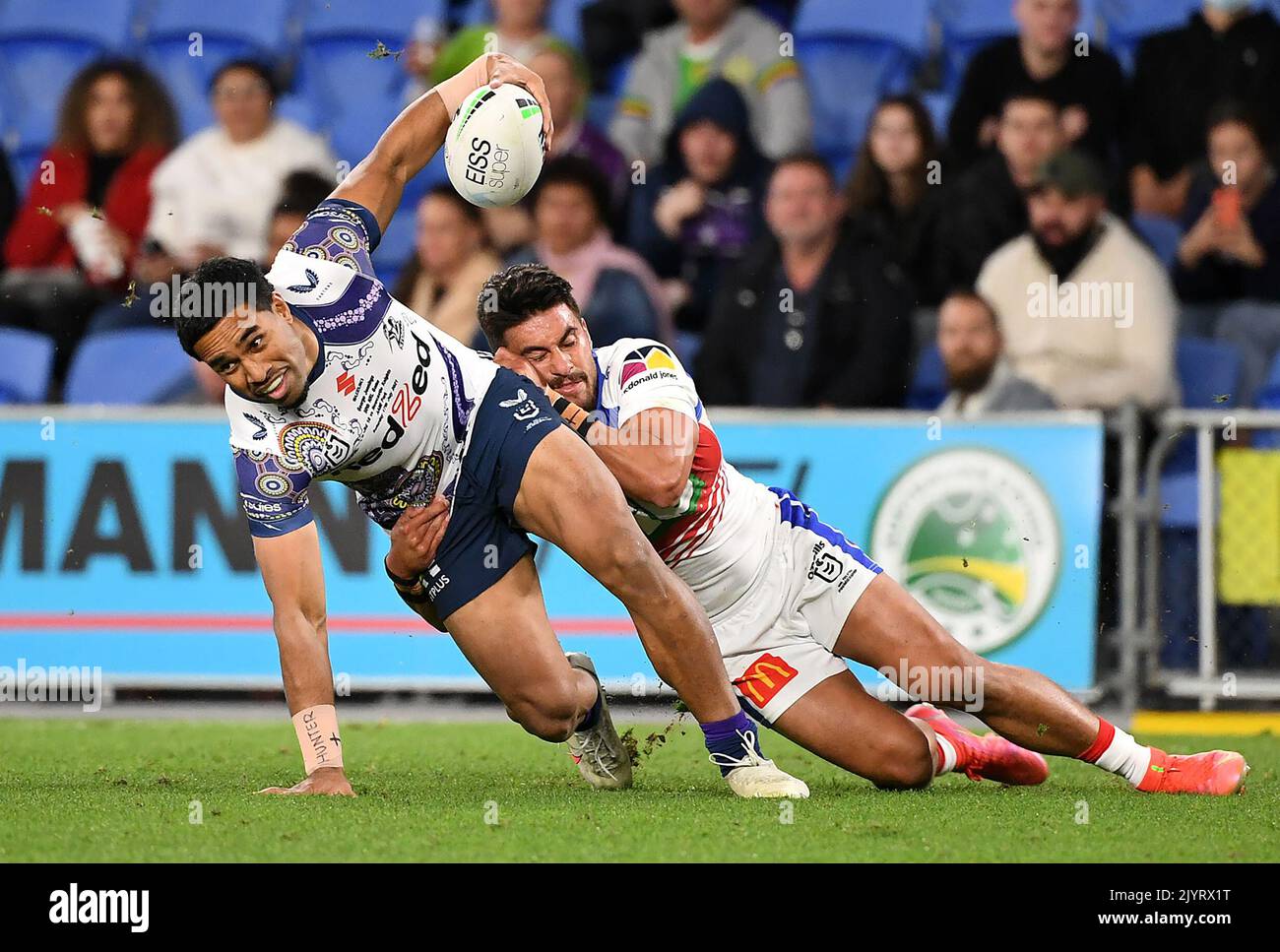 George Jennings of the Storm negotiates a tackle by Enari Tuala of the ...
