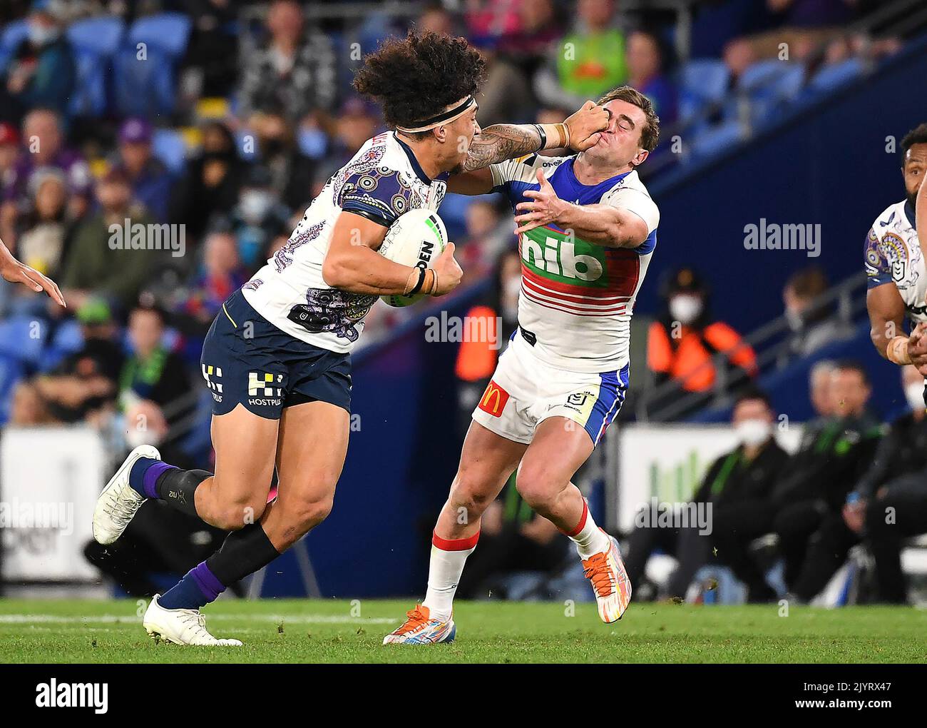 Aaron Pene of the Storm fends off Connor Watson of the Knights during ...