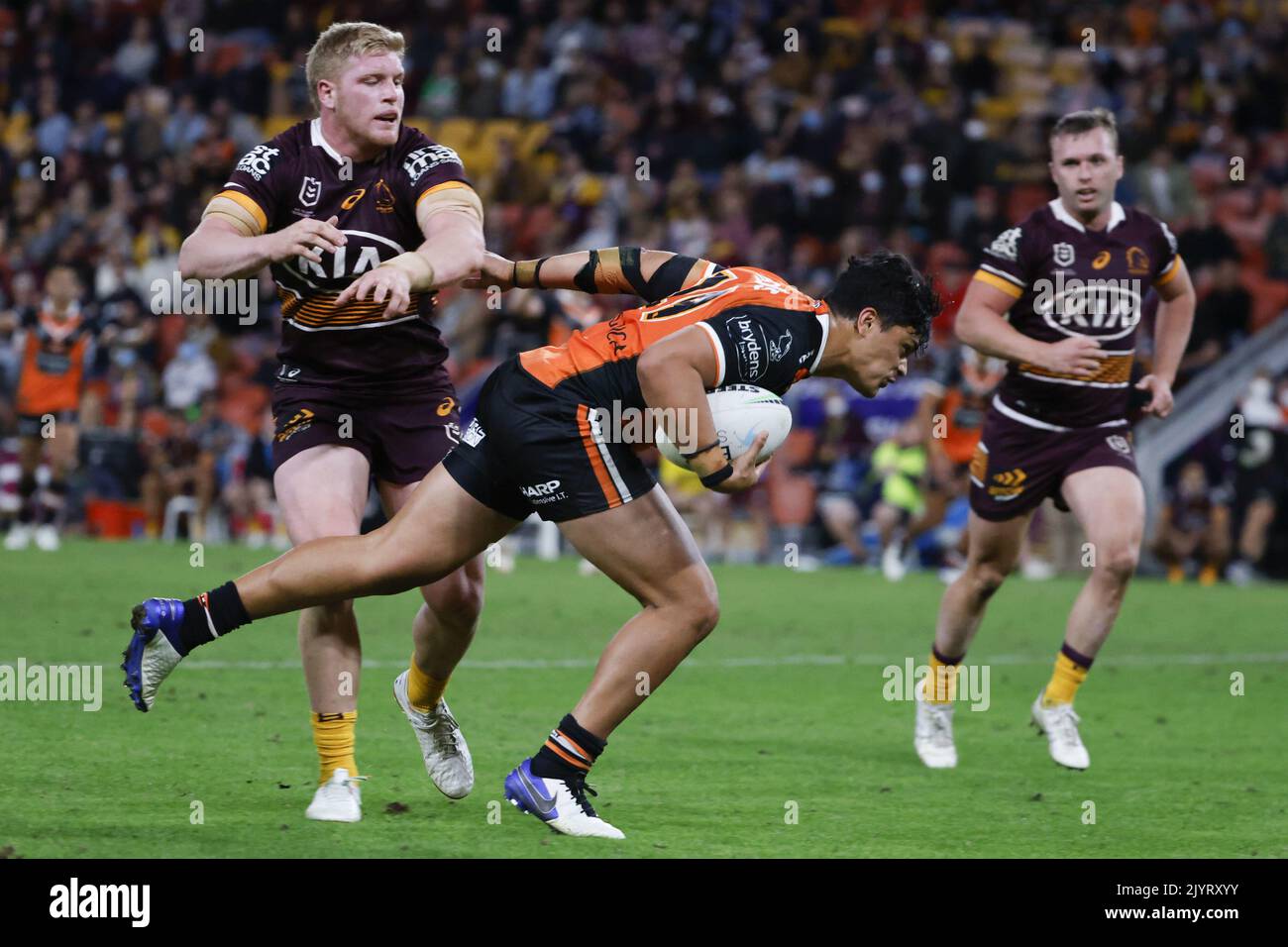 Tommy Talau of the Tigers scores a try during the Round 18 NRL match ...