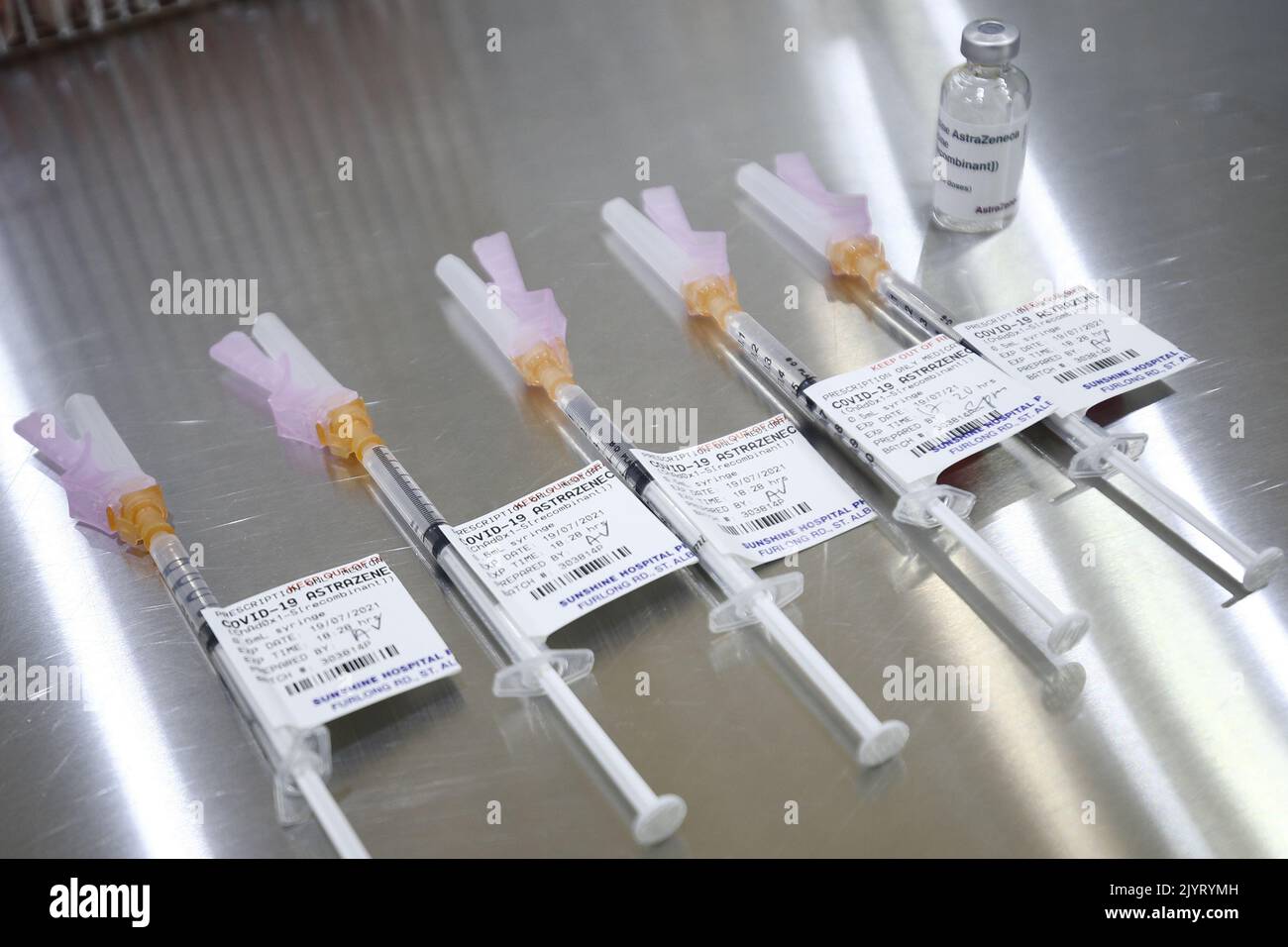 AstraZeneca syringes and a vial are seen at a mass coronavirus ...