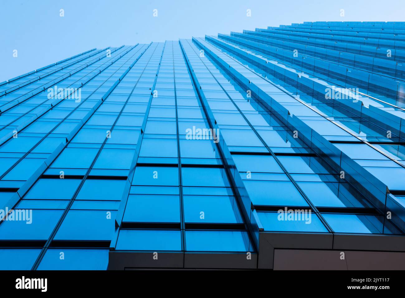 Modern glass abstract facade of an office building. View from below ...