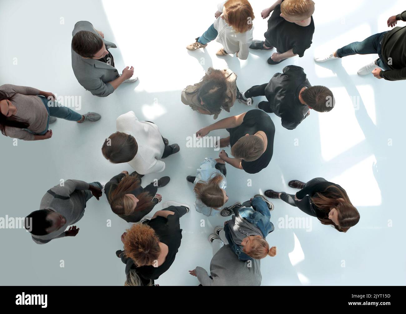 top view .groups of diverse young people moving towards each other ...