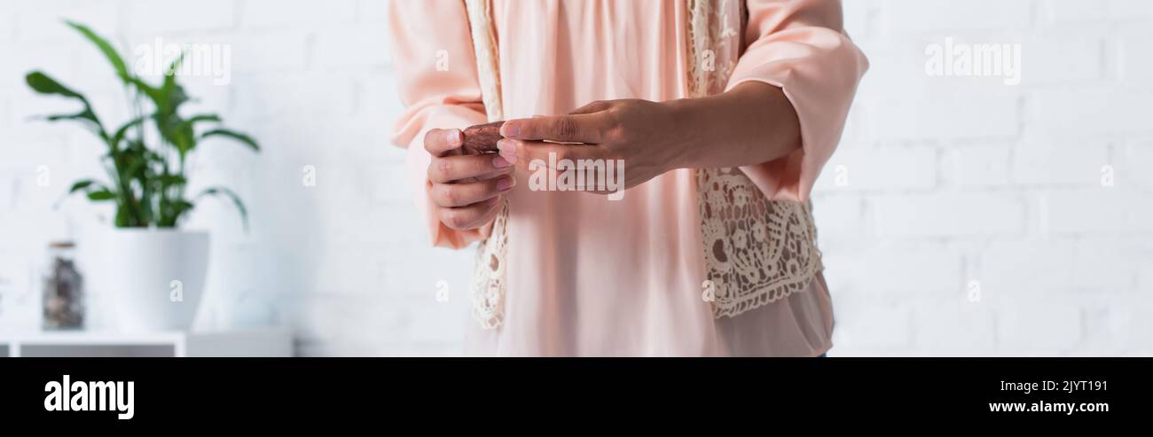 partial view of soothsayer holding clay rune, banner Stock Photo - Alamy