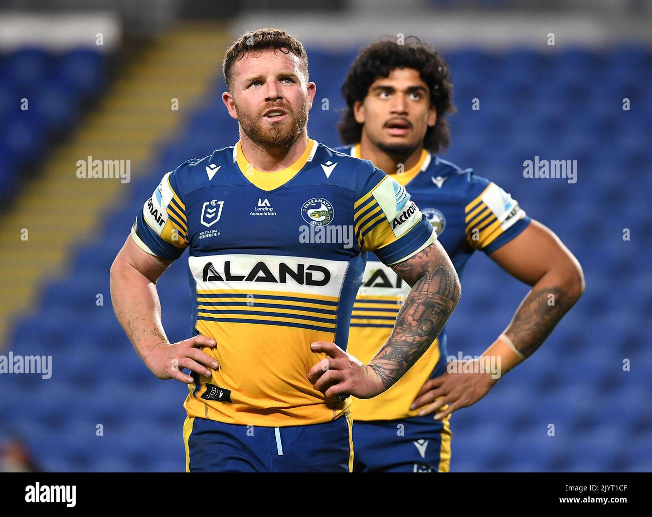Nathan Brown of the Eels (left) looks on following a Raiders try during ...