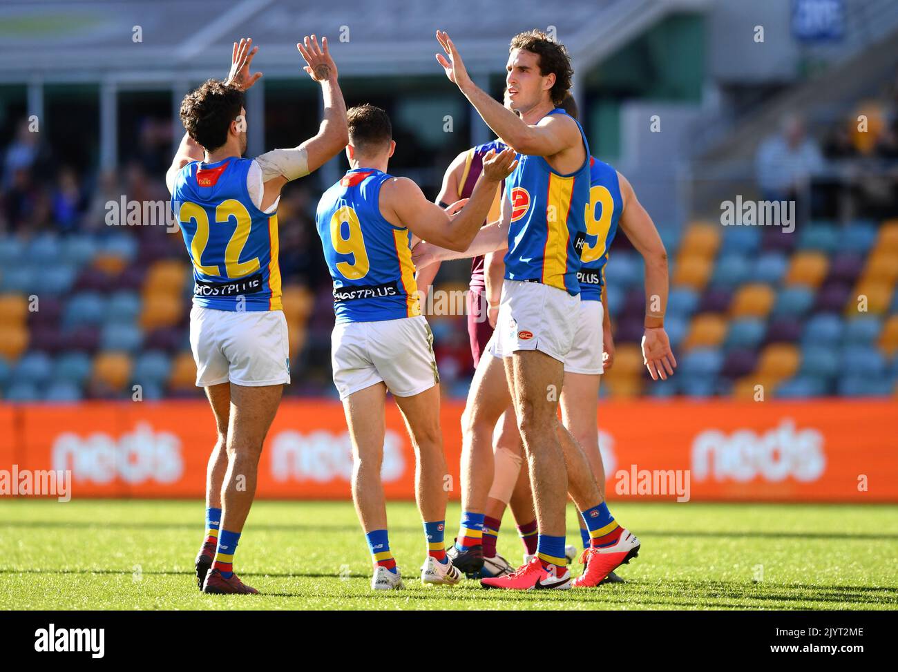 Ben King (right) of the Suns celebrates kicking a goal with team mates ...
