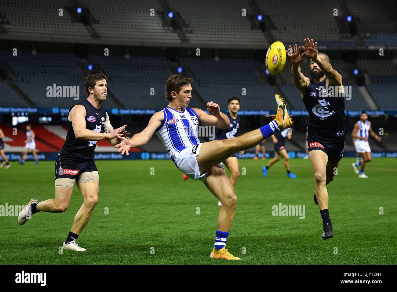 Will Phillips of North Melbourne (centre) kicks the footy during the ...