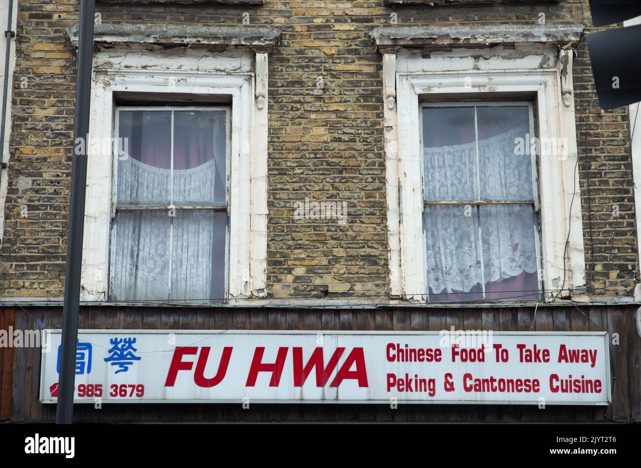 grimy, dilapidated and rundown building above a Chinese takeaway in ...