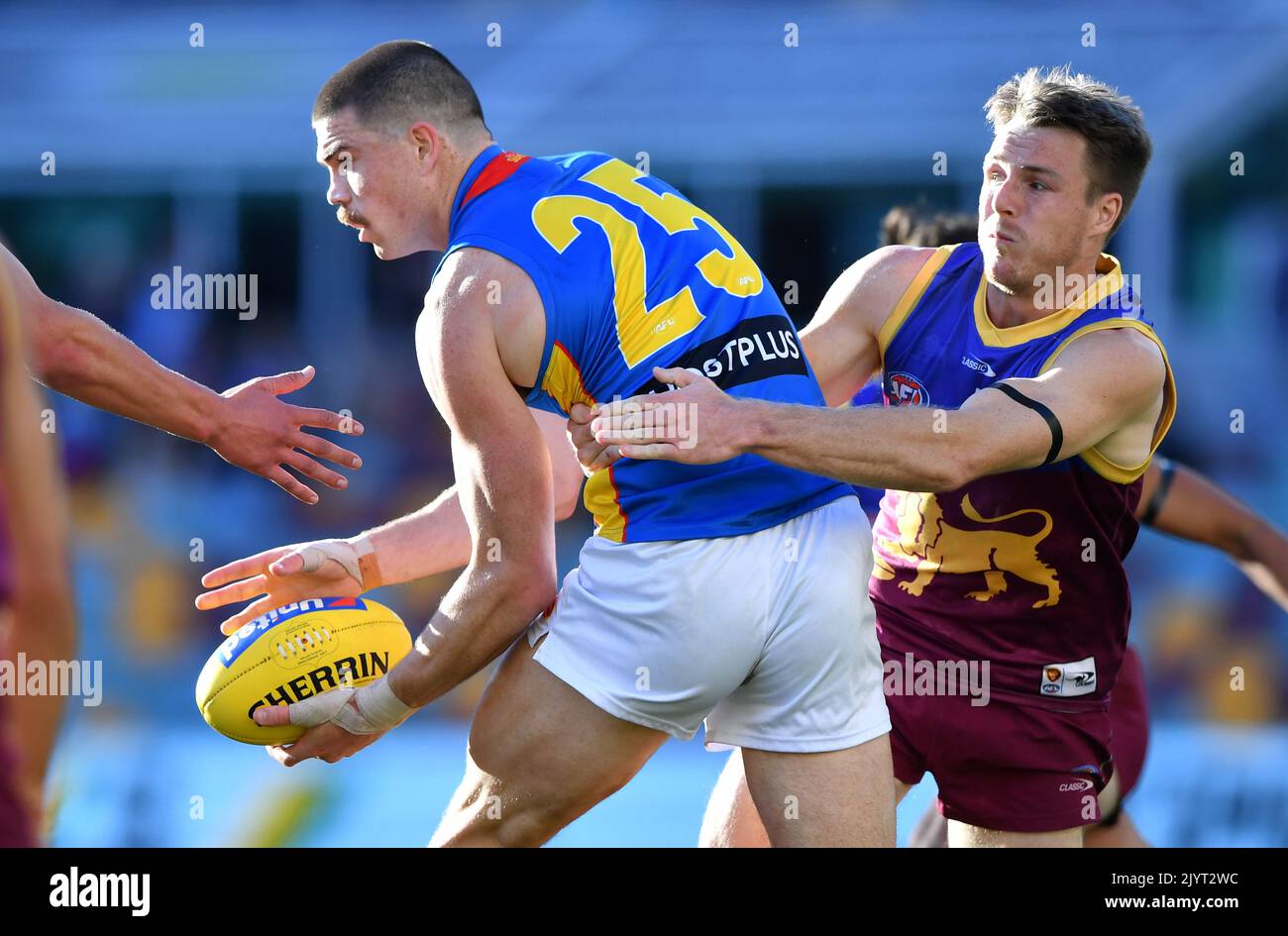 Sam Collins (left) of the Suns is tackled by Lincoln McCarthy (right ...