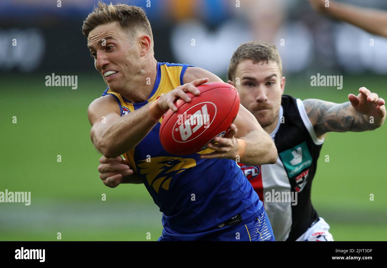 Brad Sheppard of the Eagles evades Dean Kent of the Saints during the ...