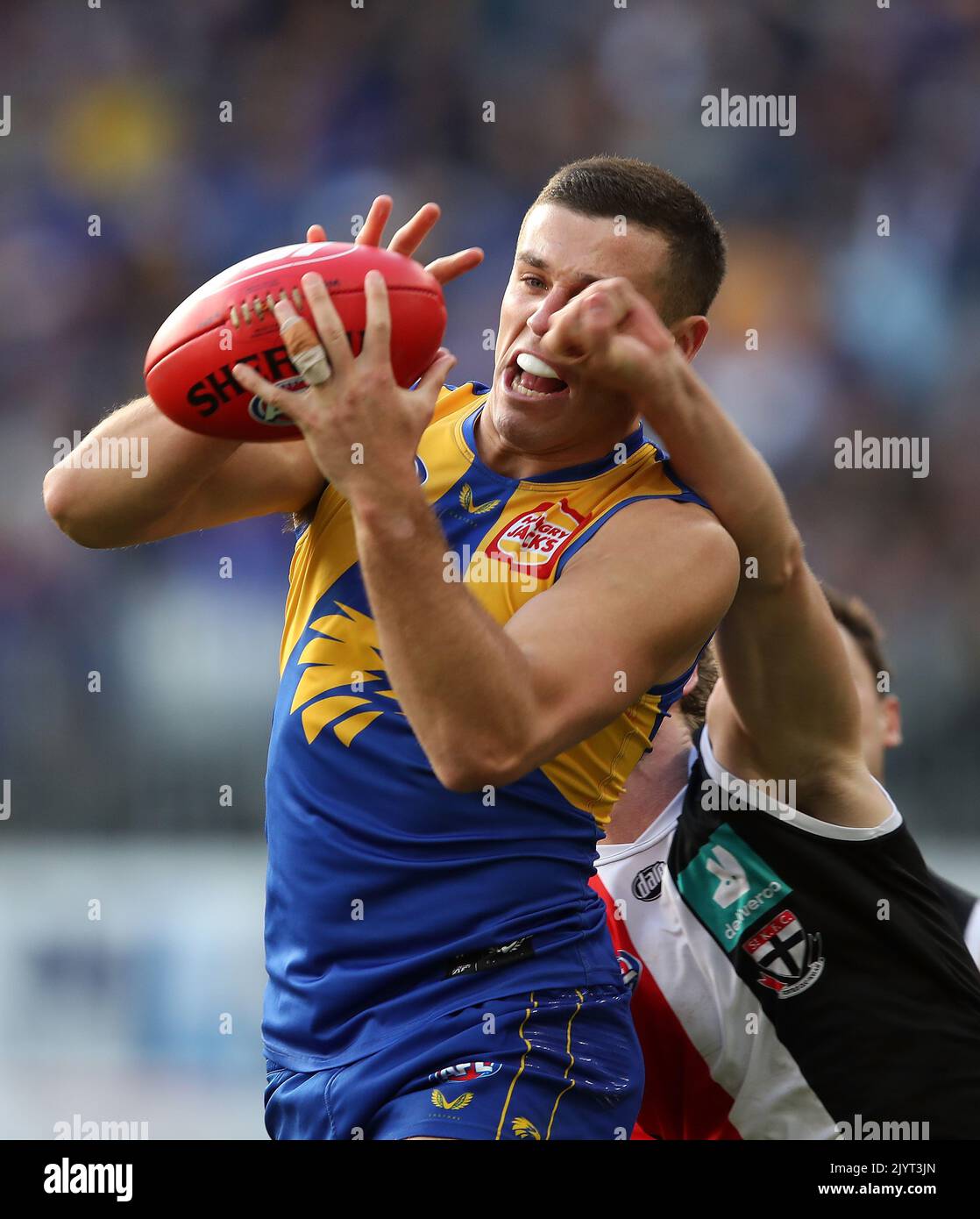 Jimmy Webster of the Saints tries to spoil a mark for Jake Waterman of ...