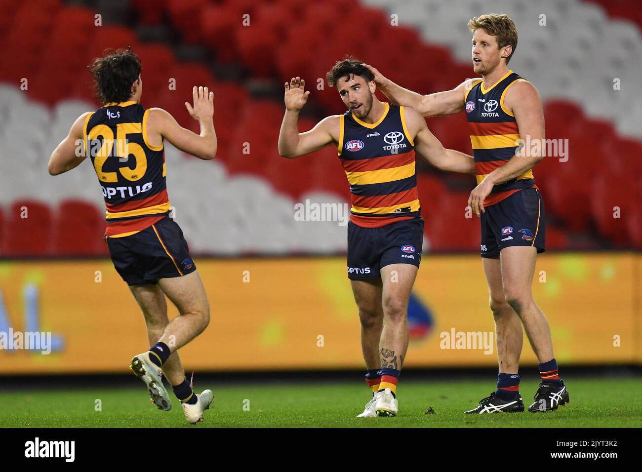 Lachlan Murphy of the Adelaide Crows (centre) celebrates with team ...