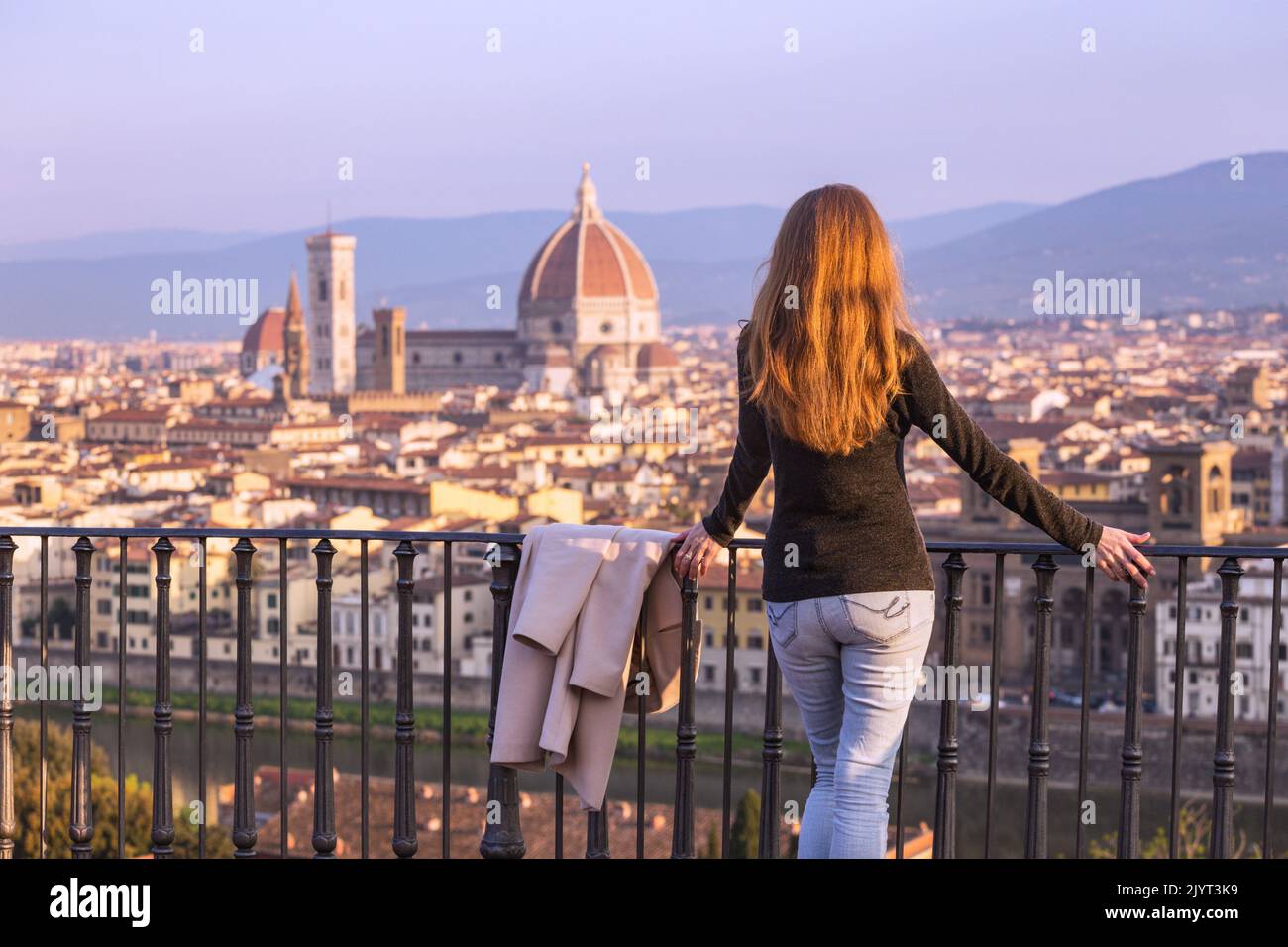 girl looking at the city of Florence from the viewpoint Stock Photo - Alamy
