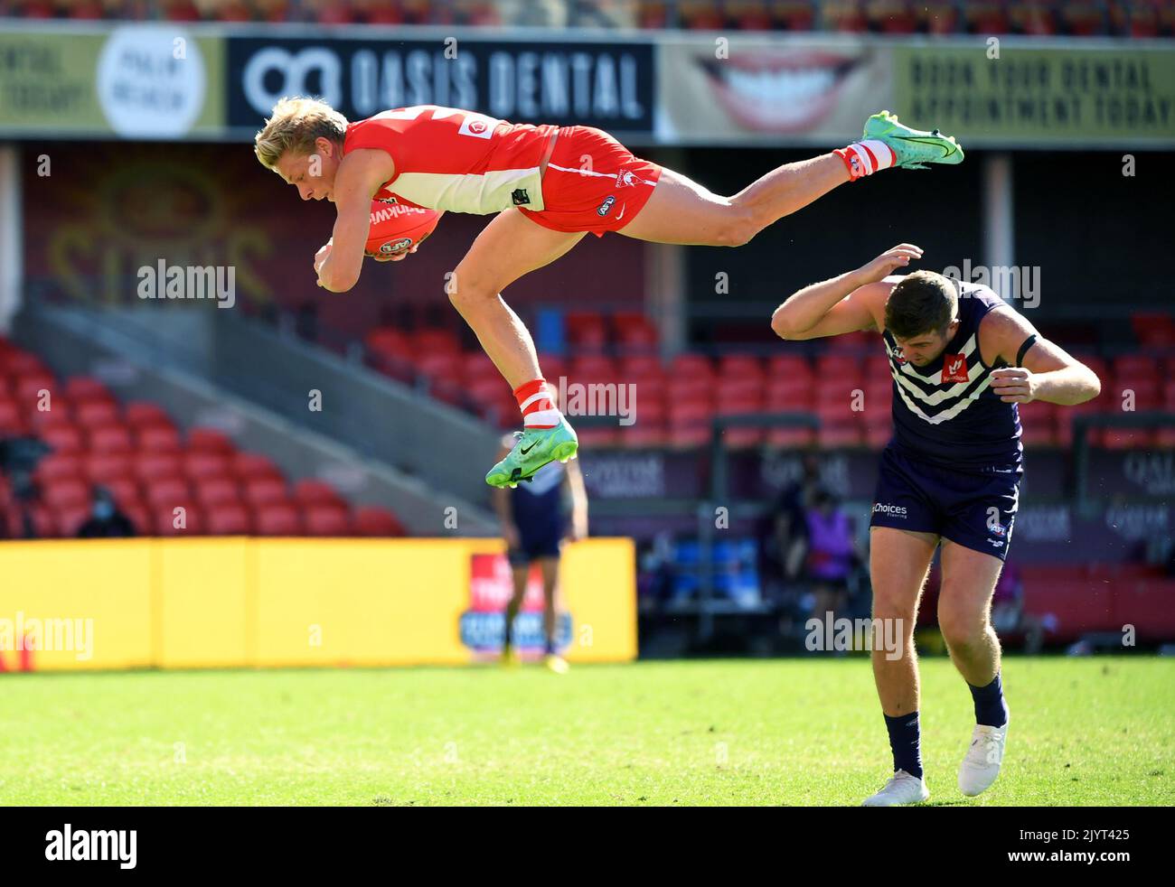 Isaac Heeney of the Swans takes a spectacular mark over Luke Ryan of ...