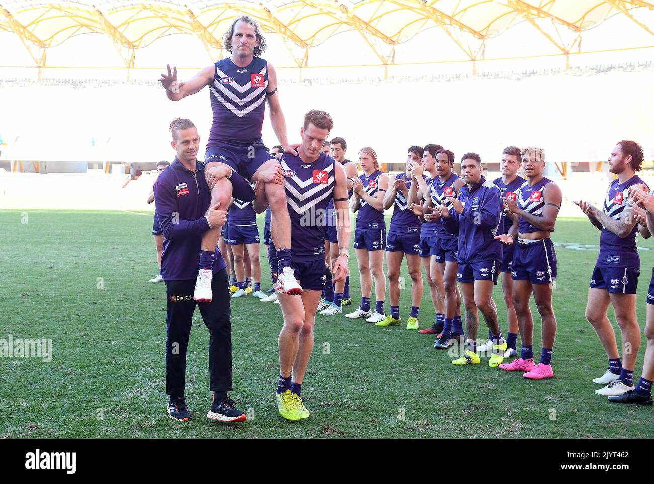 David Mundy of the Dockers is chaired from the ground following his ...
