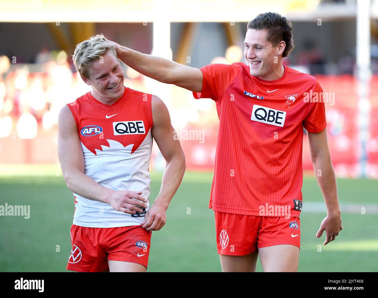 Isaac Heeney of the Swans (left) is congratulated following the Round ...