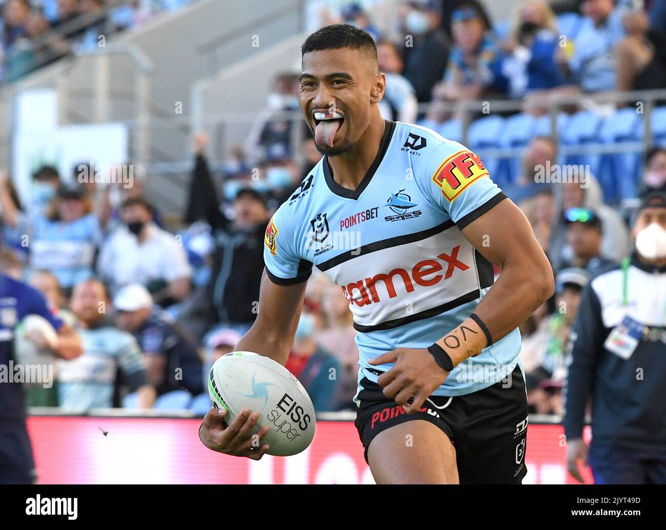 Ronaldo Mulitalo of the Sharks celebrates scoring a try during the ...