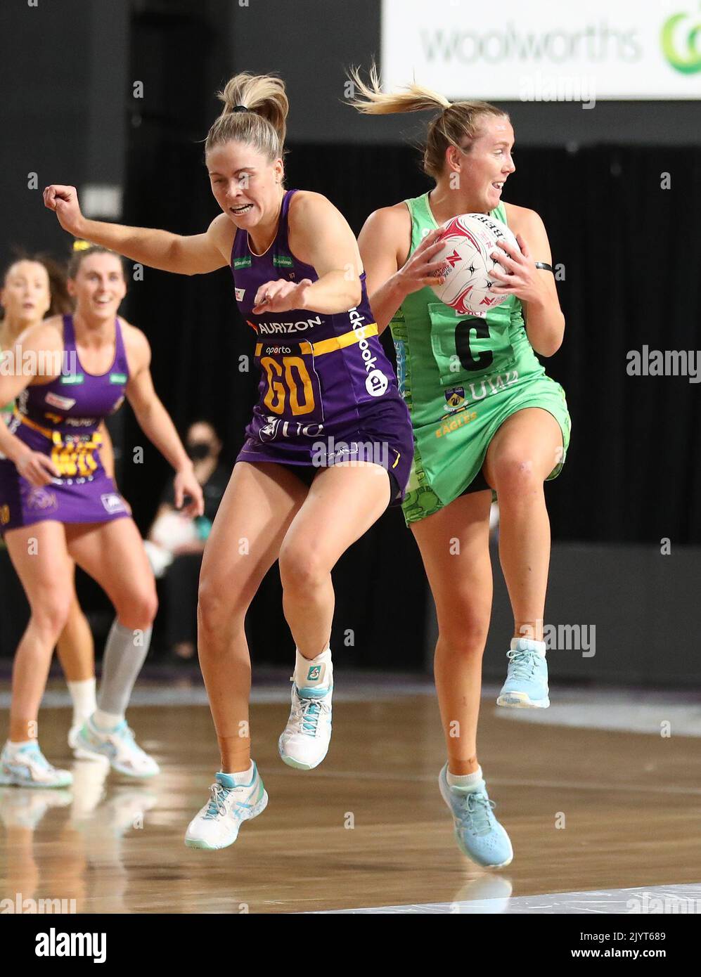 Kim Jenner of the Firebirds ( L) in action with Jess Anstiss of the ...