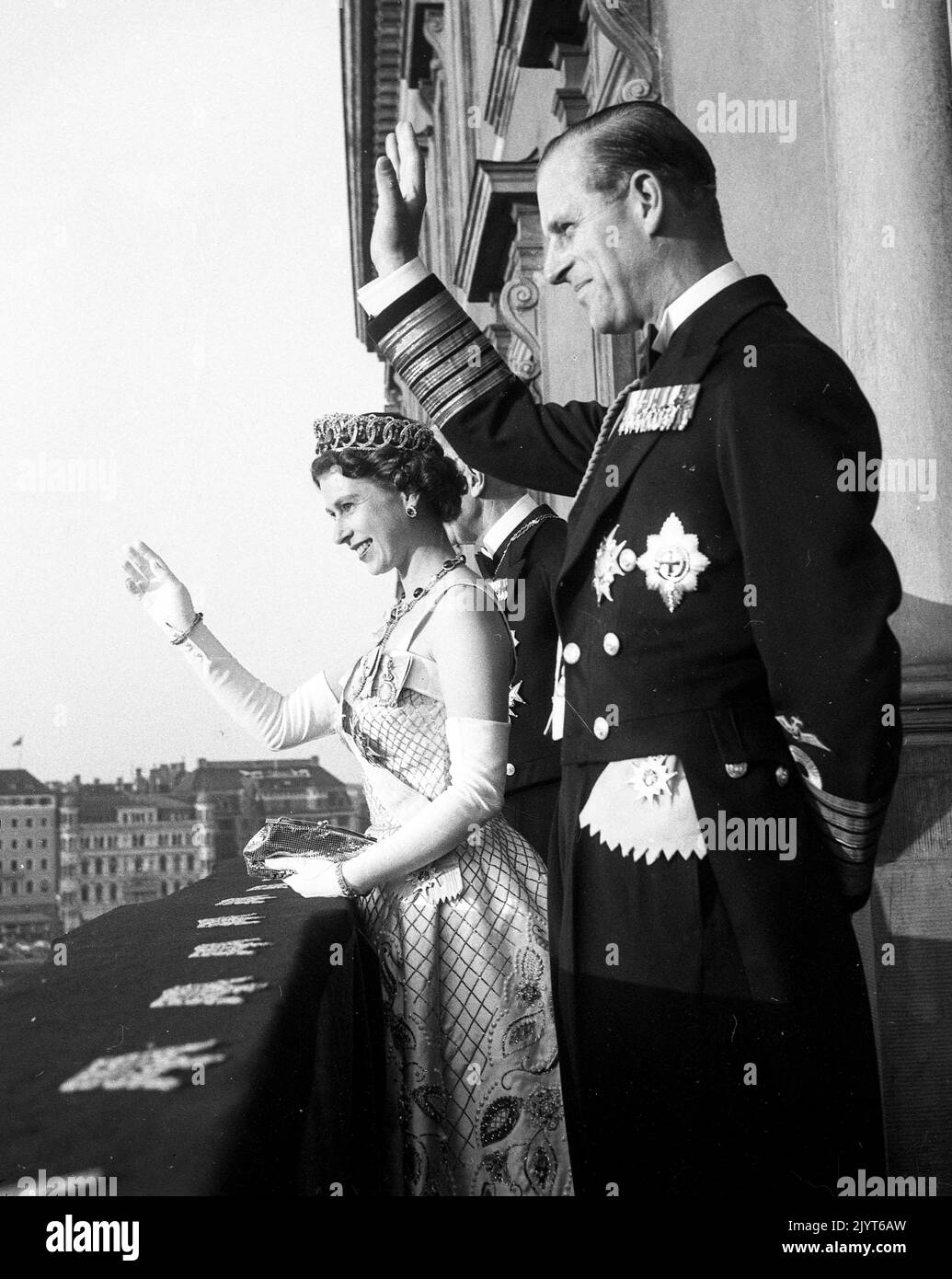 Queen Elizabeth II and Prince Philip waving to the crowds from the ...
