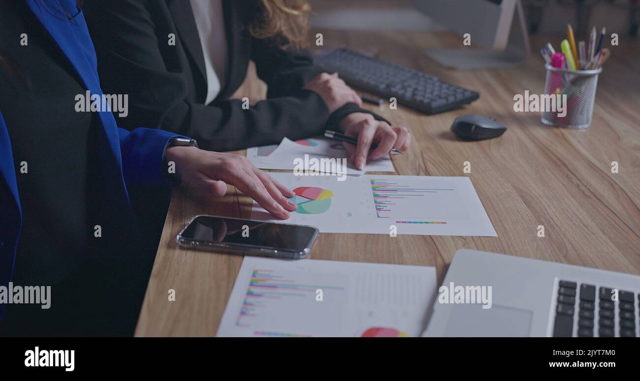 Office female leader explaining work to young employees. Businesswoman ...