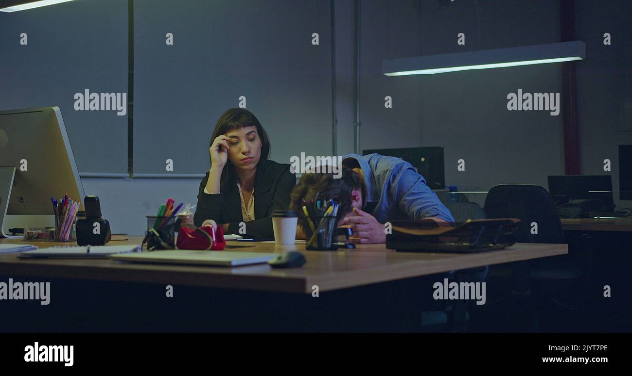 Unhappy workers hitting head on table feeling frustration working over ...