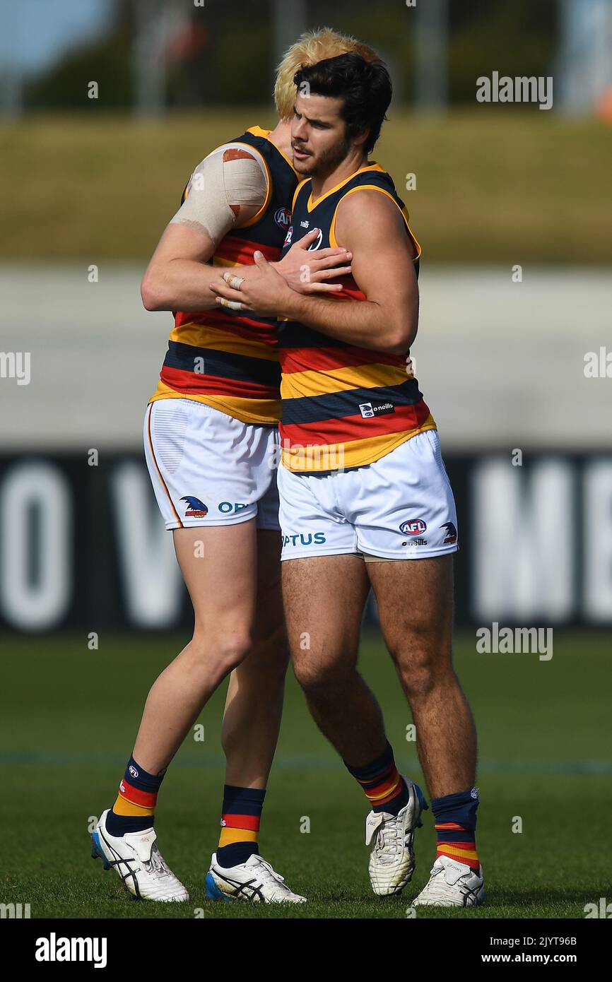Darcy Fogarty of the Adelaide Crows (right) celebrates with team mates ...
