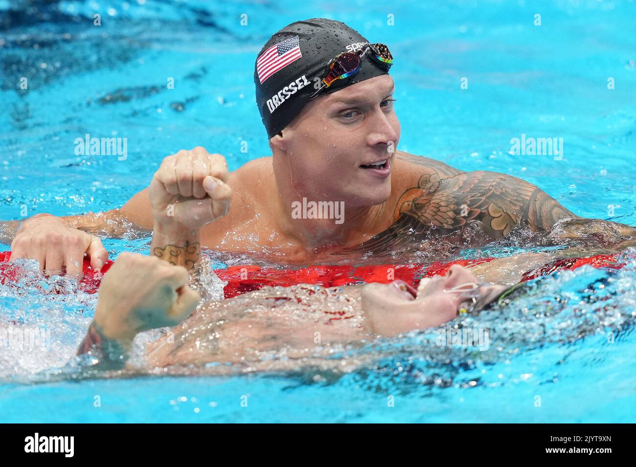 Caeleb Dressel of the USA celebrates his Gold medal win as Bruno Fratus ...