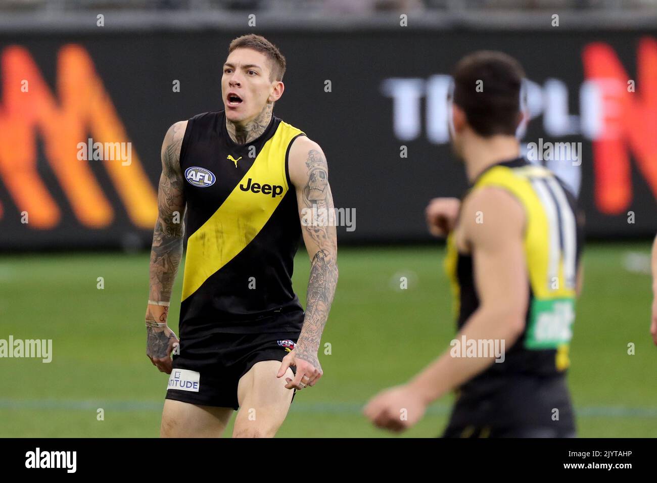 Matthew Parker of the Tigers reacts after kicking a goal during the ...