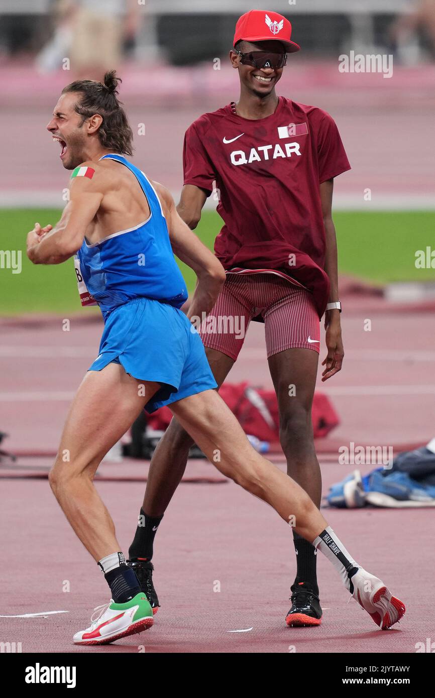 Gianmarco Tamberi of Italy and Mutaz Ess Barshim of Qatar celebrate as ...