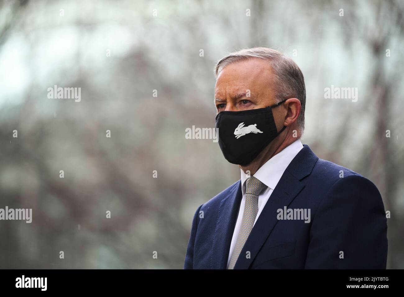 Australian Opposition leader Anthony Albanese wears a face mask during ...