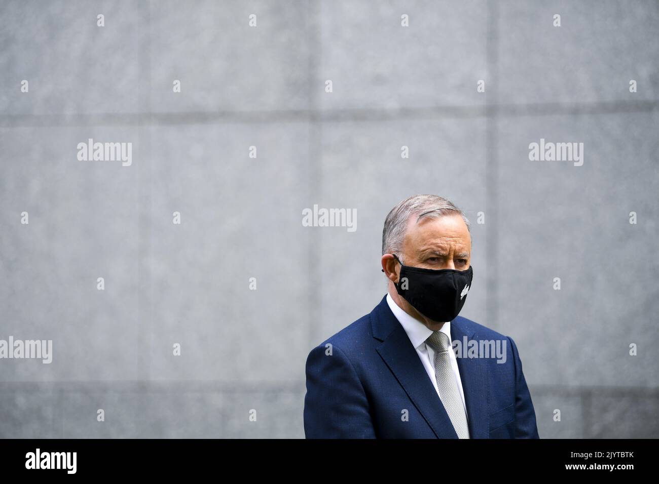 Australian Opposition leader Anthony Albanese wears a face mask during ...