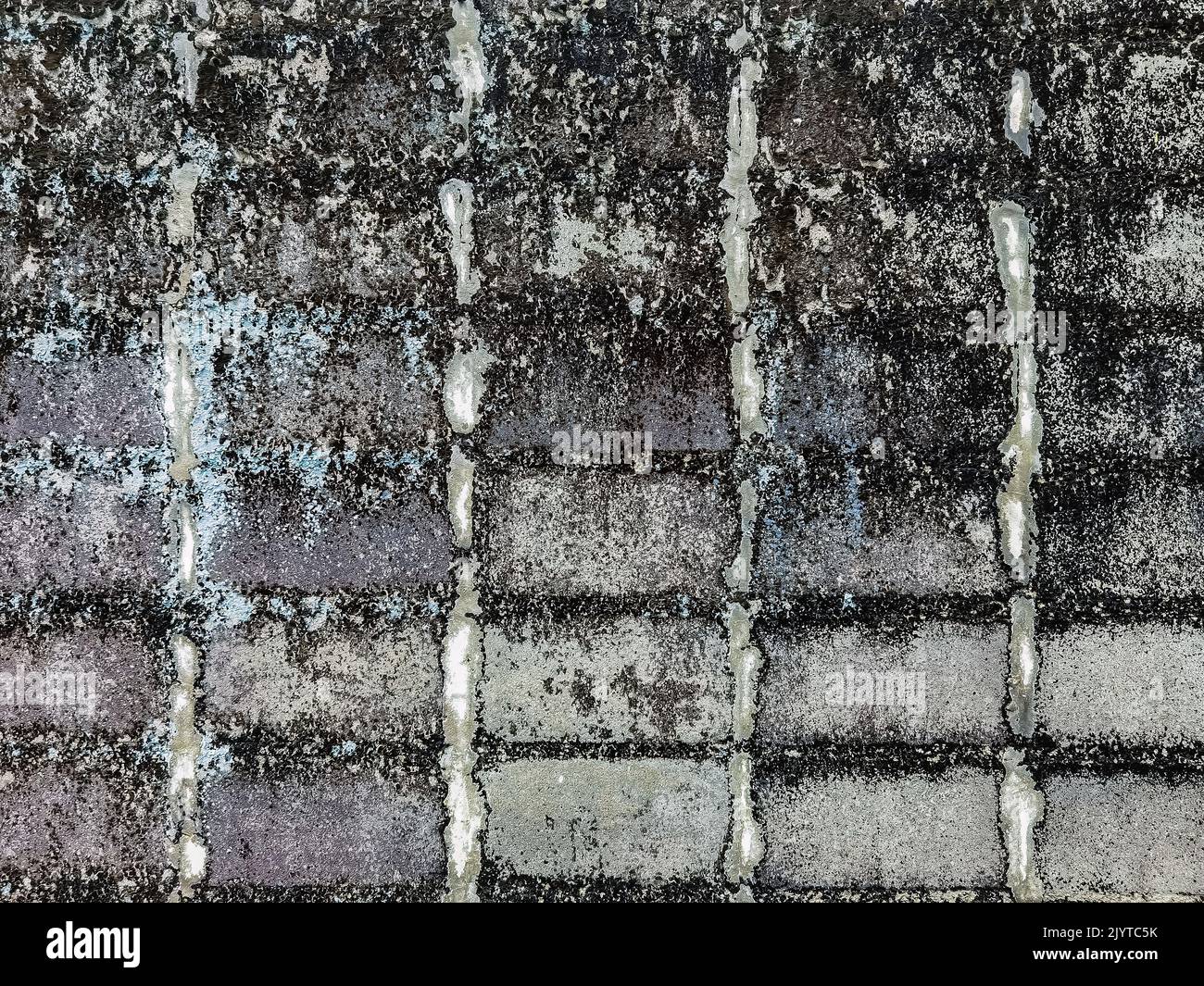 Dirty old eroded cracked plaster cement block fence. Concrete block ...