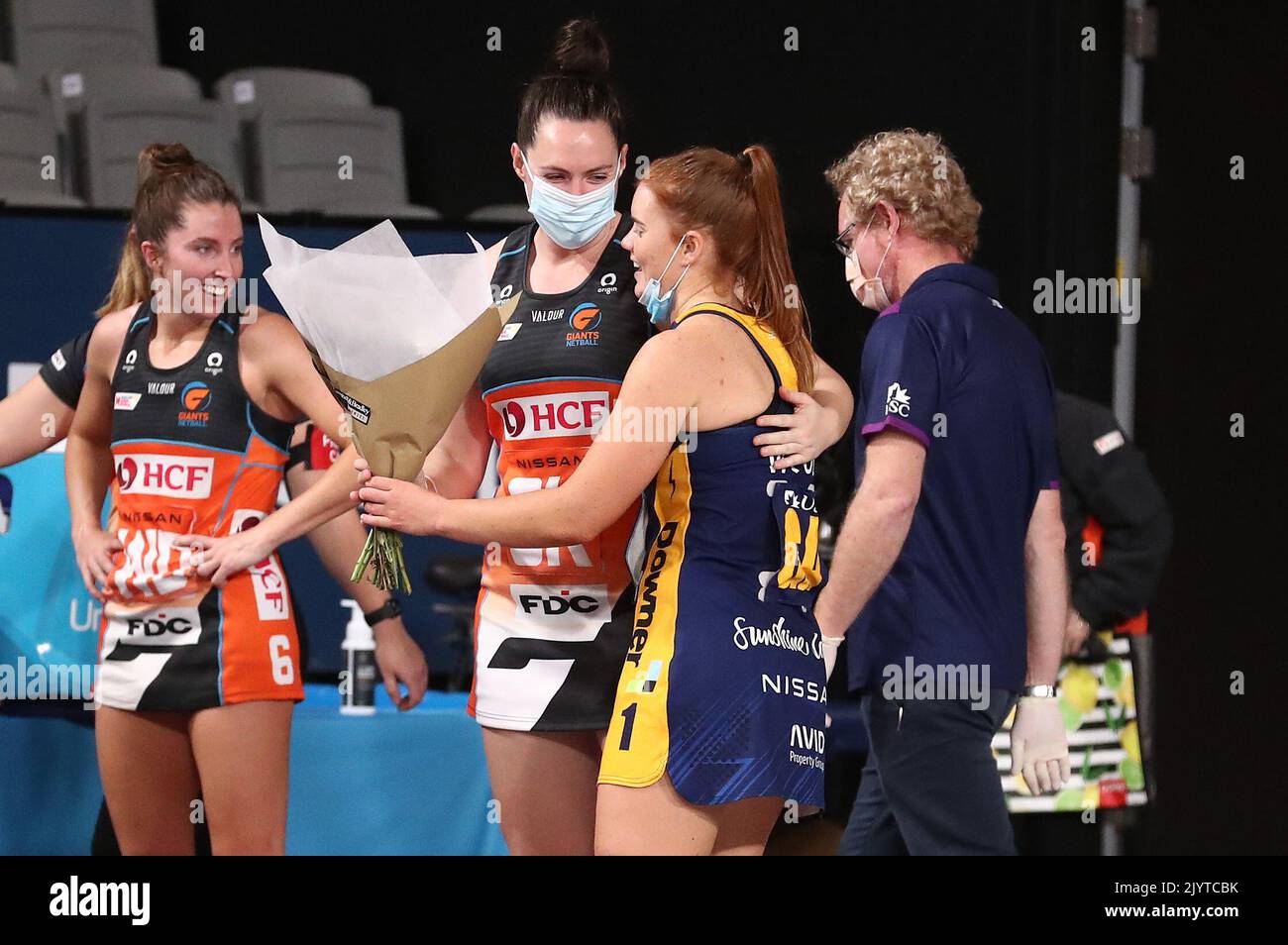 Steph Wood of the Lightning and Sam Poolman of the Giants embrace after ...