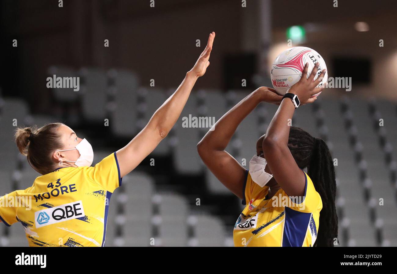 Lauren Moore ( L ) and Sam Wallace of the Swifts warms up during the ...
