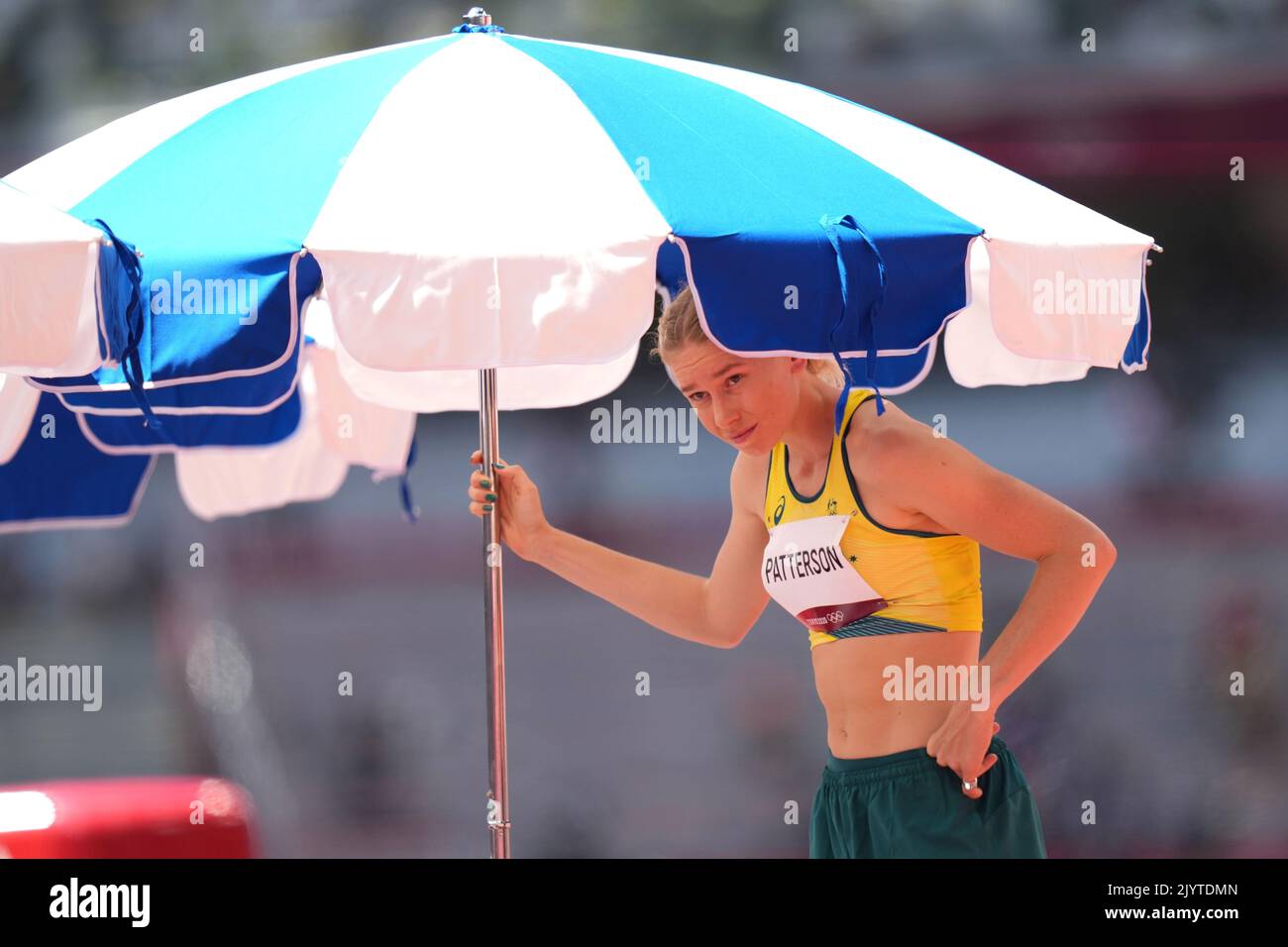 Eleanor Patterson of Australia stands in the shade of an umbrella ...