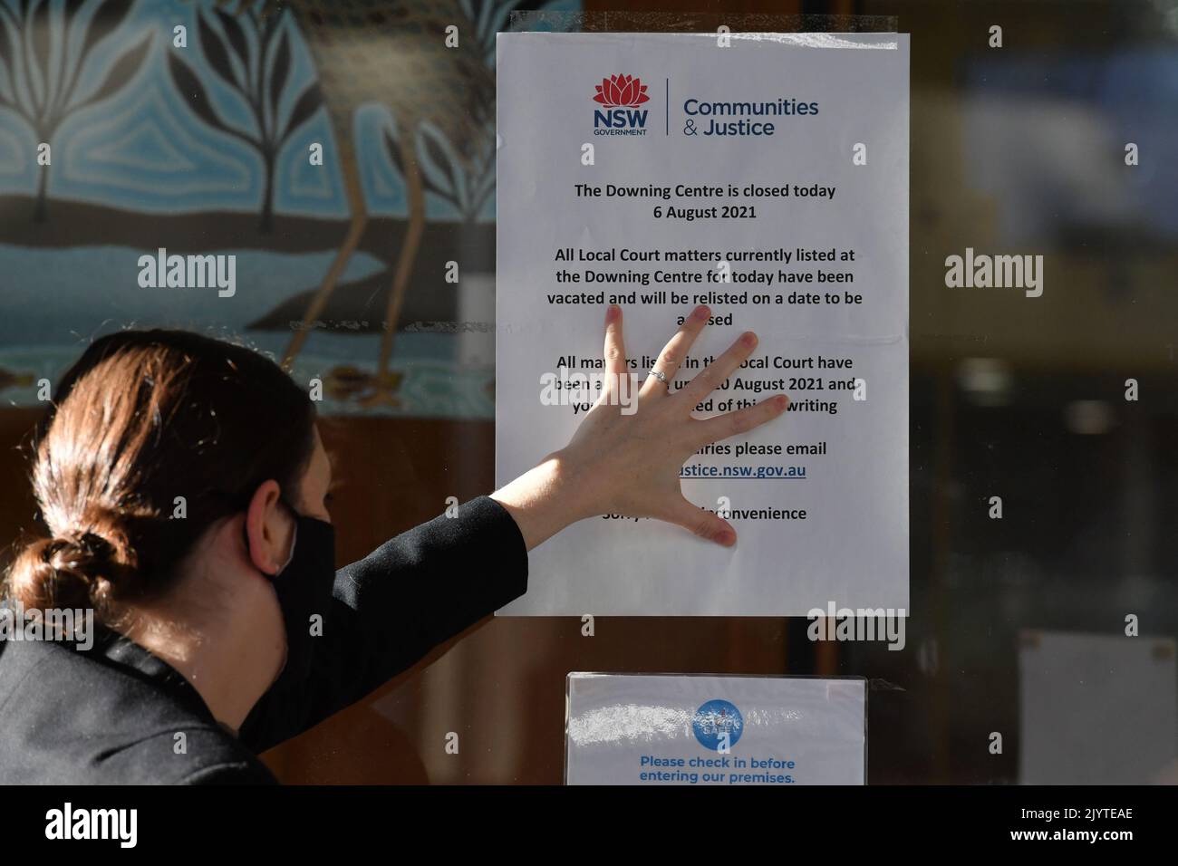 Court attendants put up signs indicating that the Downing Centre ...