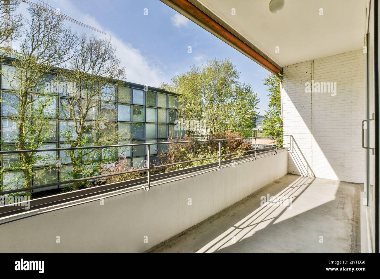 Front view of buildings from narrow balcony with railings Stock Photo ...