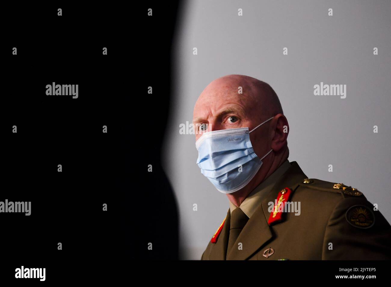 COVID-19 Taskforce Commander, Lieutenant General John Frewen listens to ...