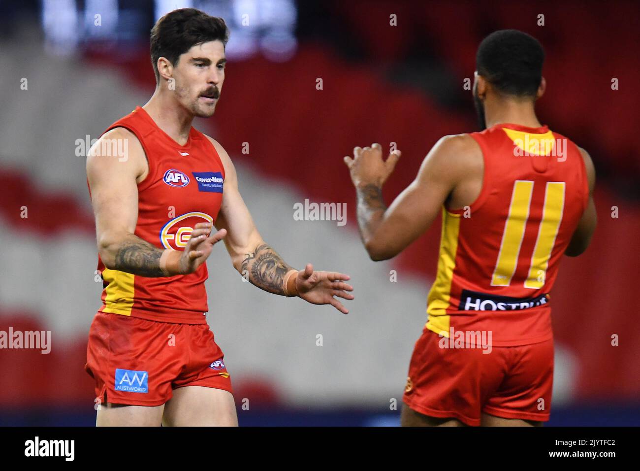 Alex Sexton of the Suns (left) celebrates with team mates after kicking ...
