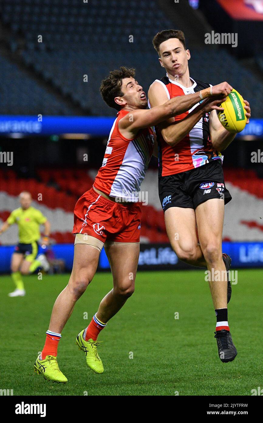 Cooper Sharman (right) of St Kilda marks the footy during the AFL Round ...