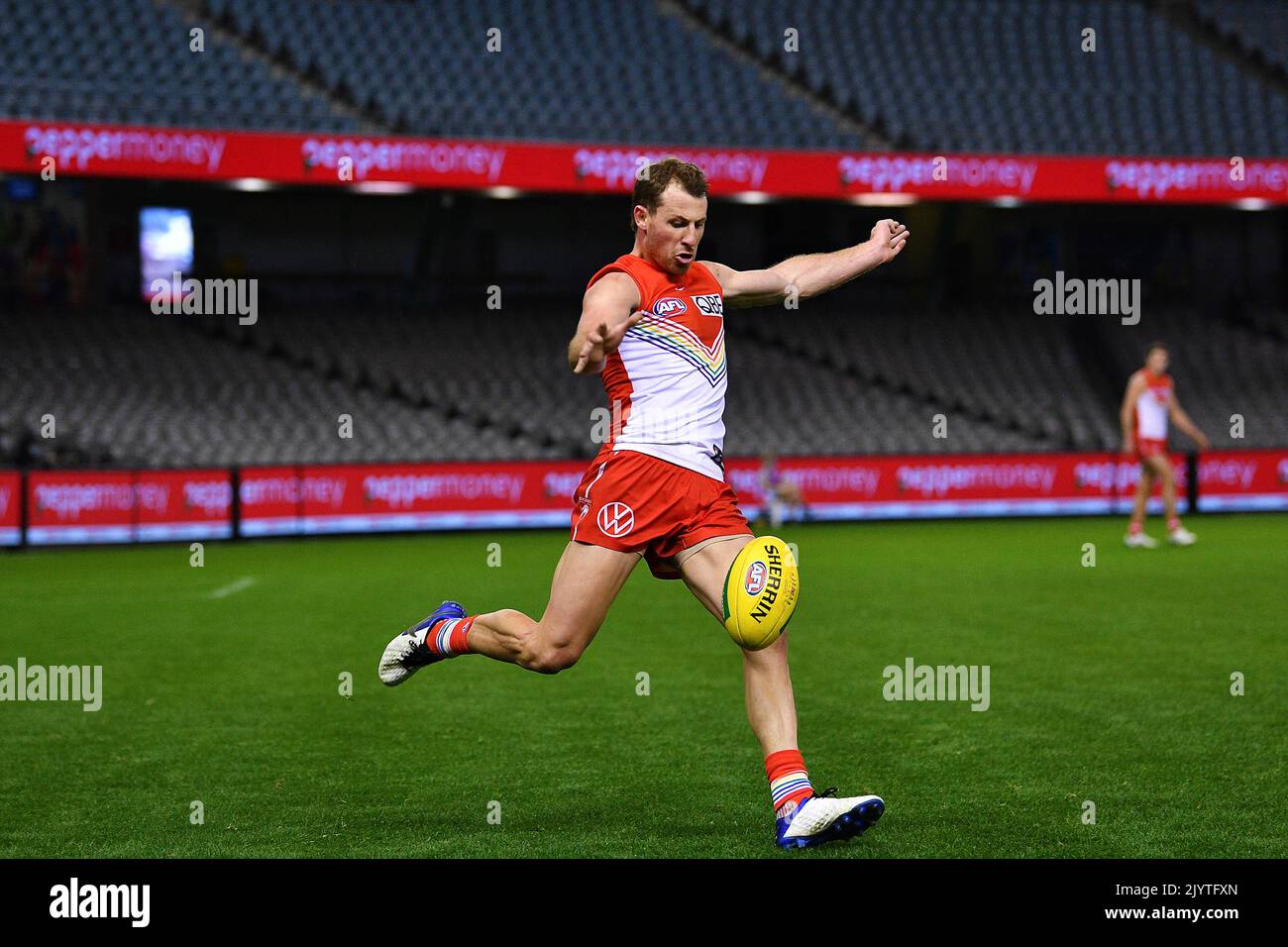Harry Cunningham of the Swans kicks the footy during the AFL Round 21 ...