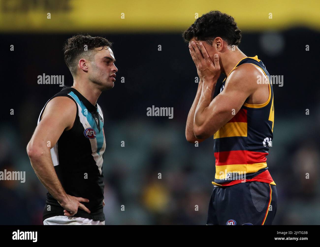 Karl Amon of the Power and Ben Davis of the Crows after the final siren ...