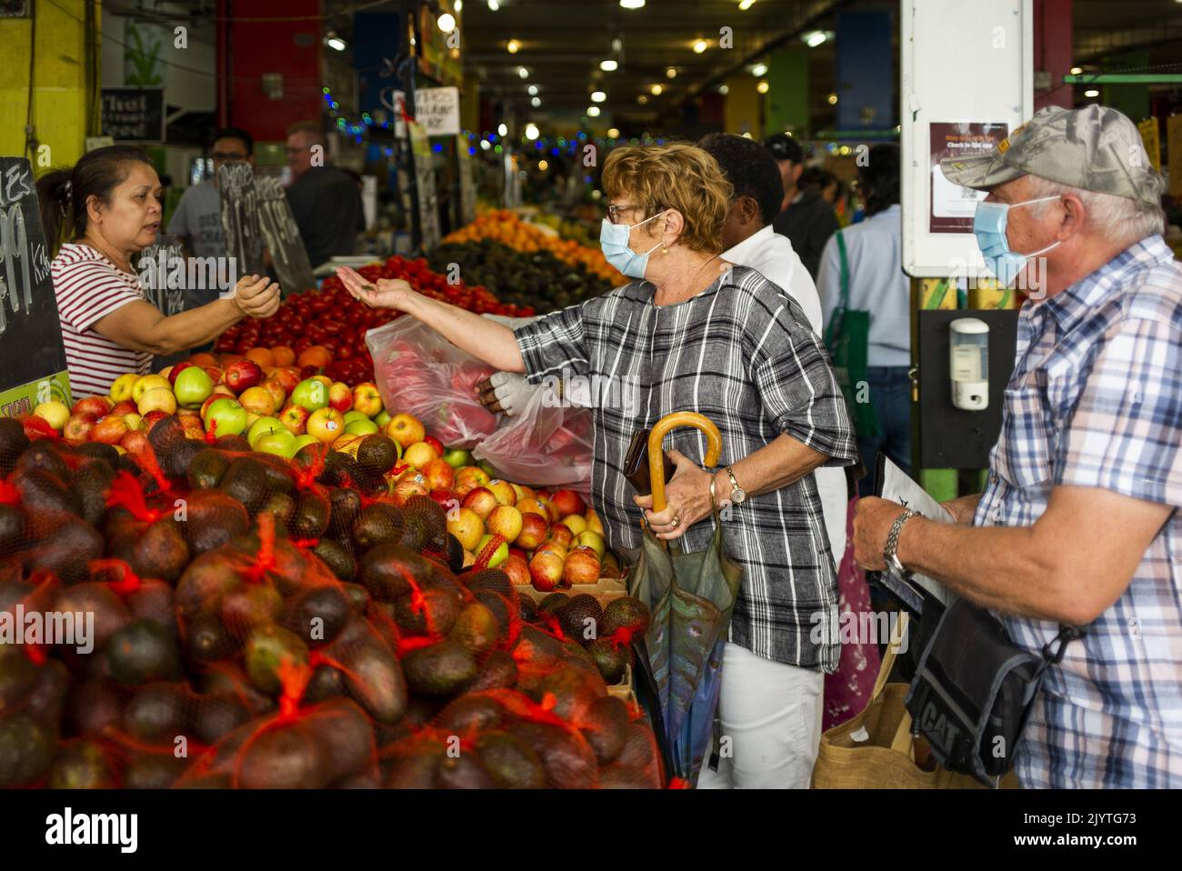 People shop for fresh produce at Rusty’s Markets in Cairns, Sunday ...