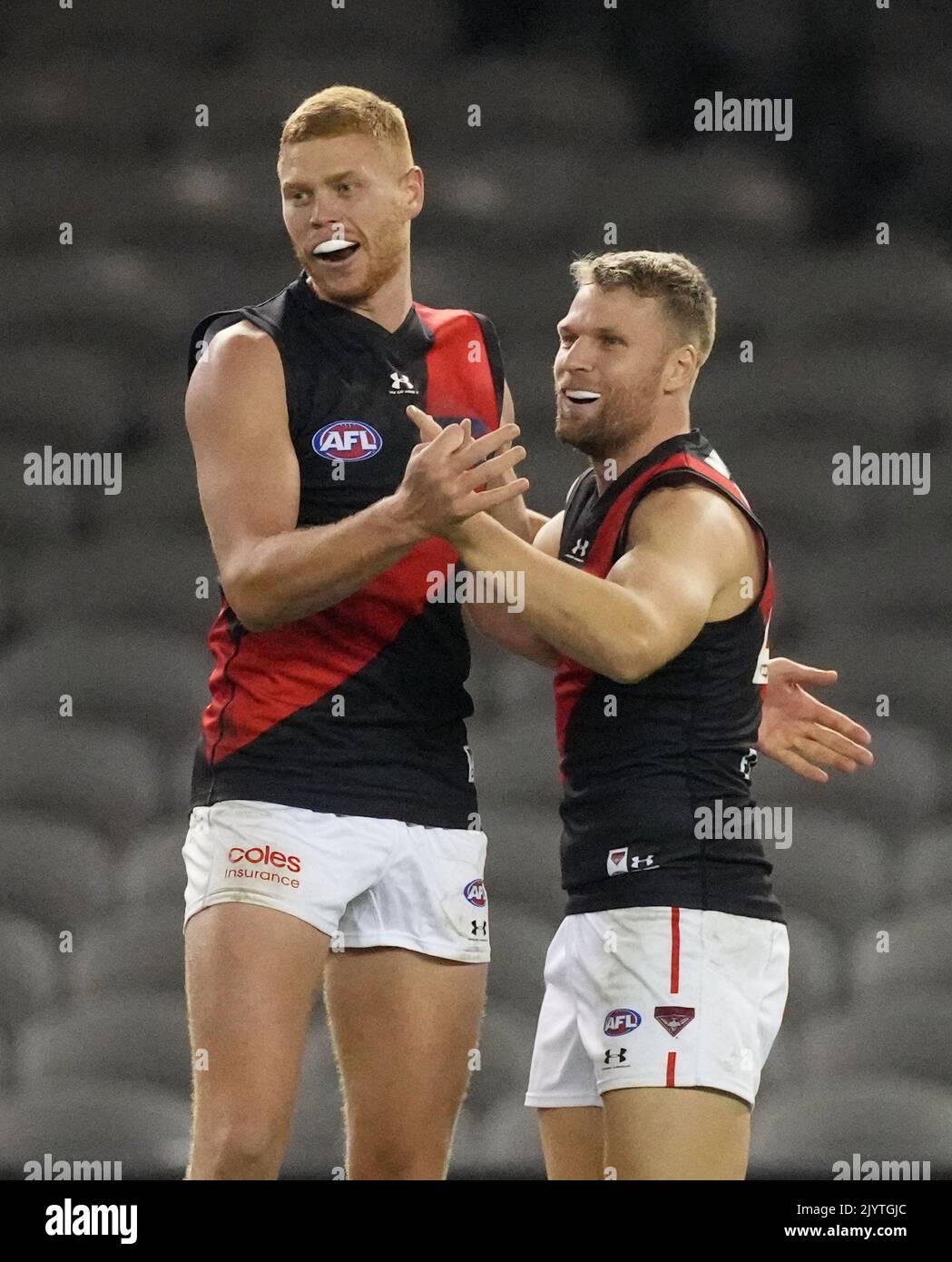 Peter Wright of the Bombers celebrates after kicking a goal with Jake ...