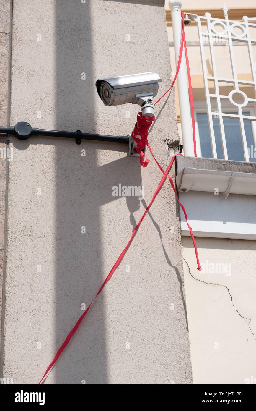 A security camera draped in red streamers from the Jersey Liberation ...