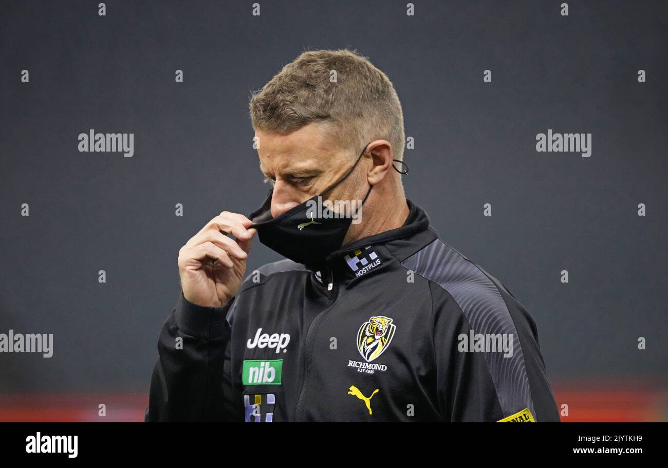 Damien Hardwick, coach of the Tigers leaves the field after speaking to ...