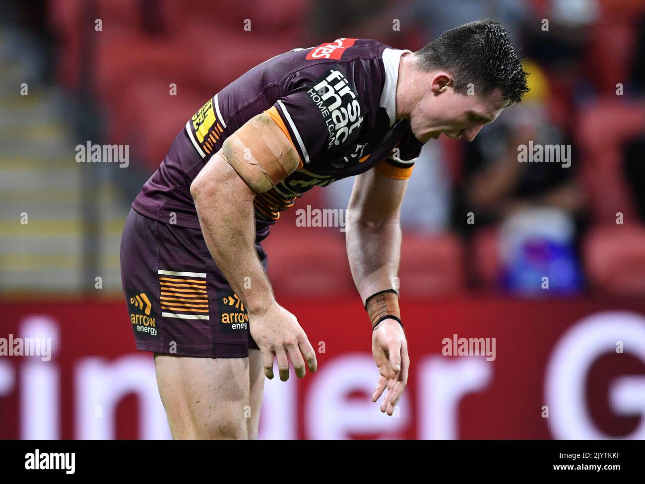 Tyson Gamble of the Broncos is seen reacting after injuring his hand ...