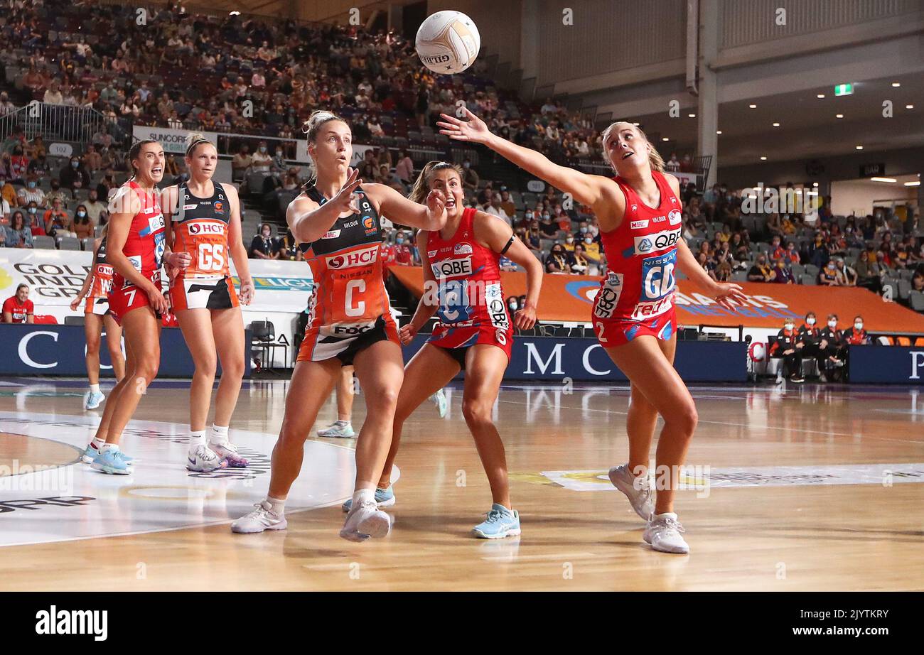Jamie-Lee Price of the Giants in action with Maddy Turner of the Swifts ...